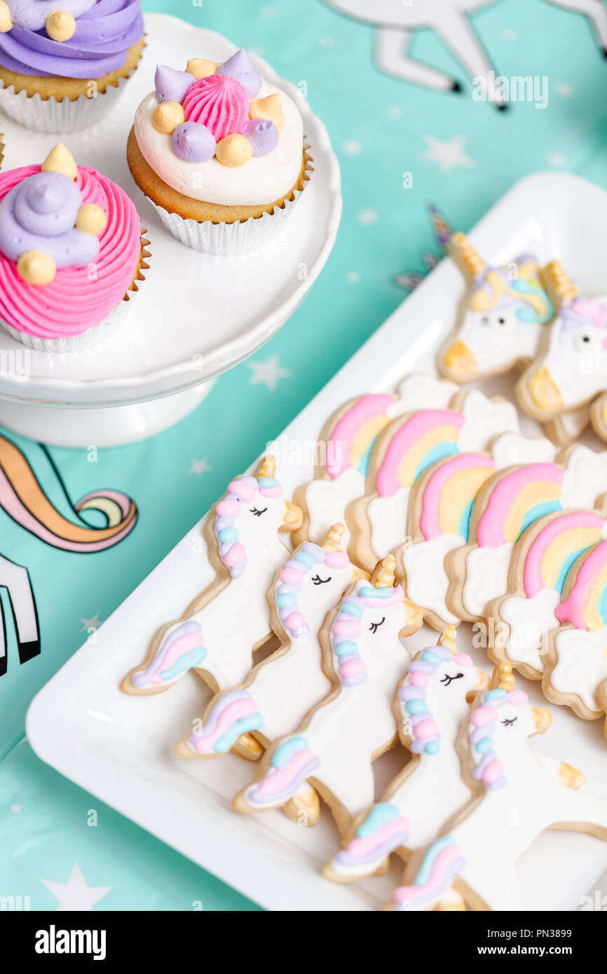 Unicorn sugar cookies on serving tray at little girl birthday party ...