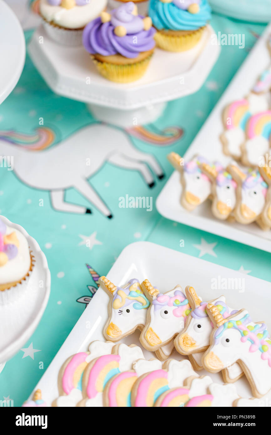 Unicorn sugar cookies on serving tray at little girl birthday party ...