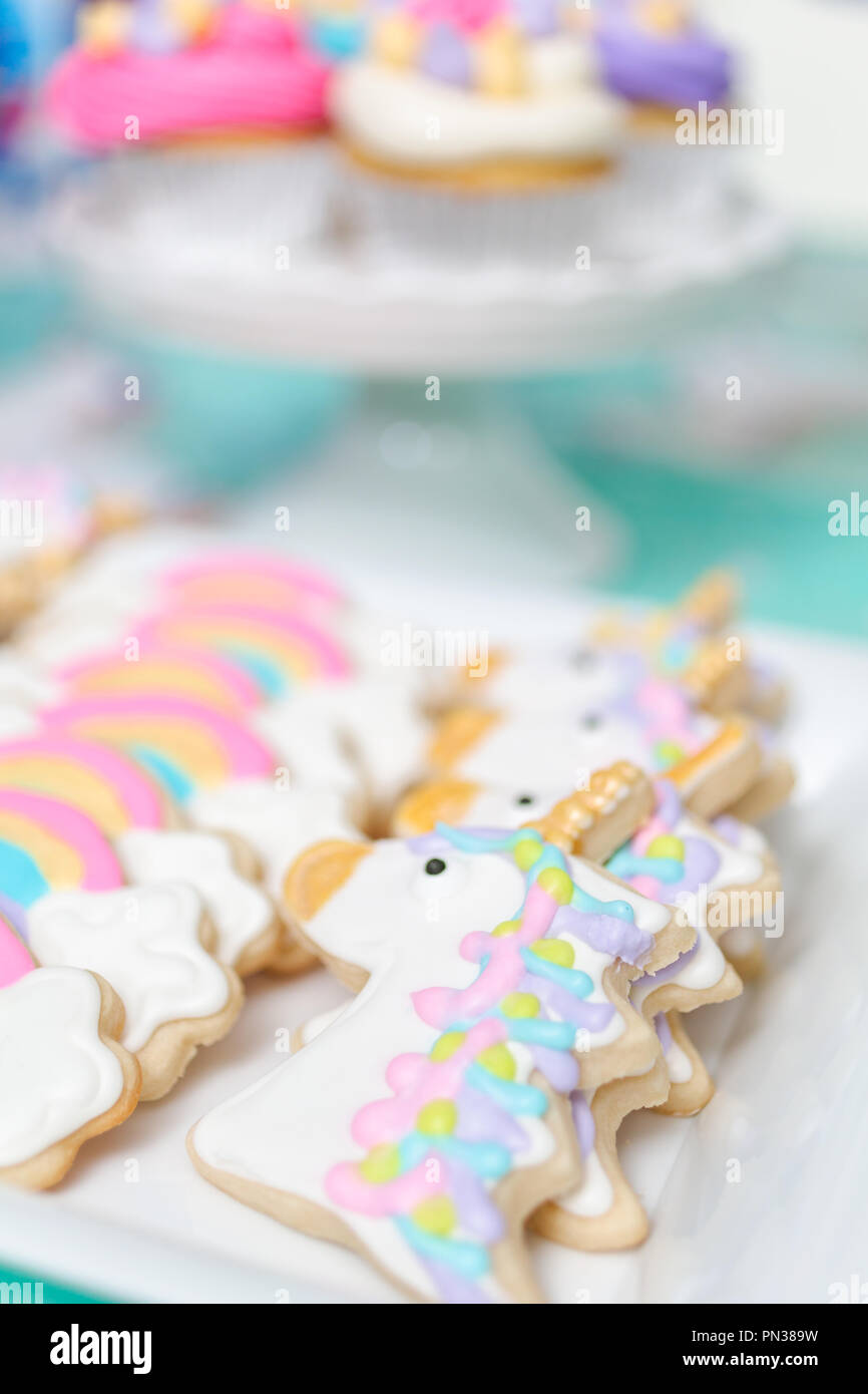 Unicorn sugar cookies on serving tray at little girl birthday party ...
