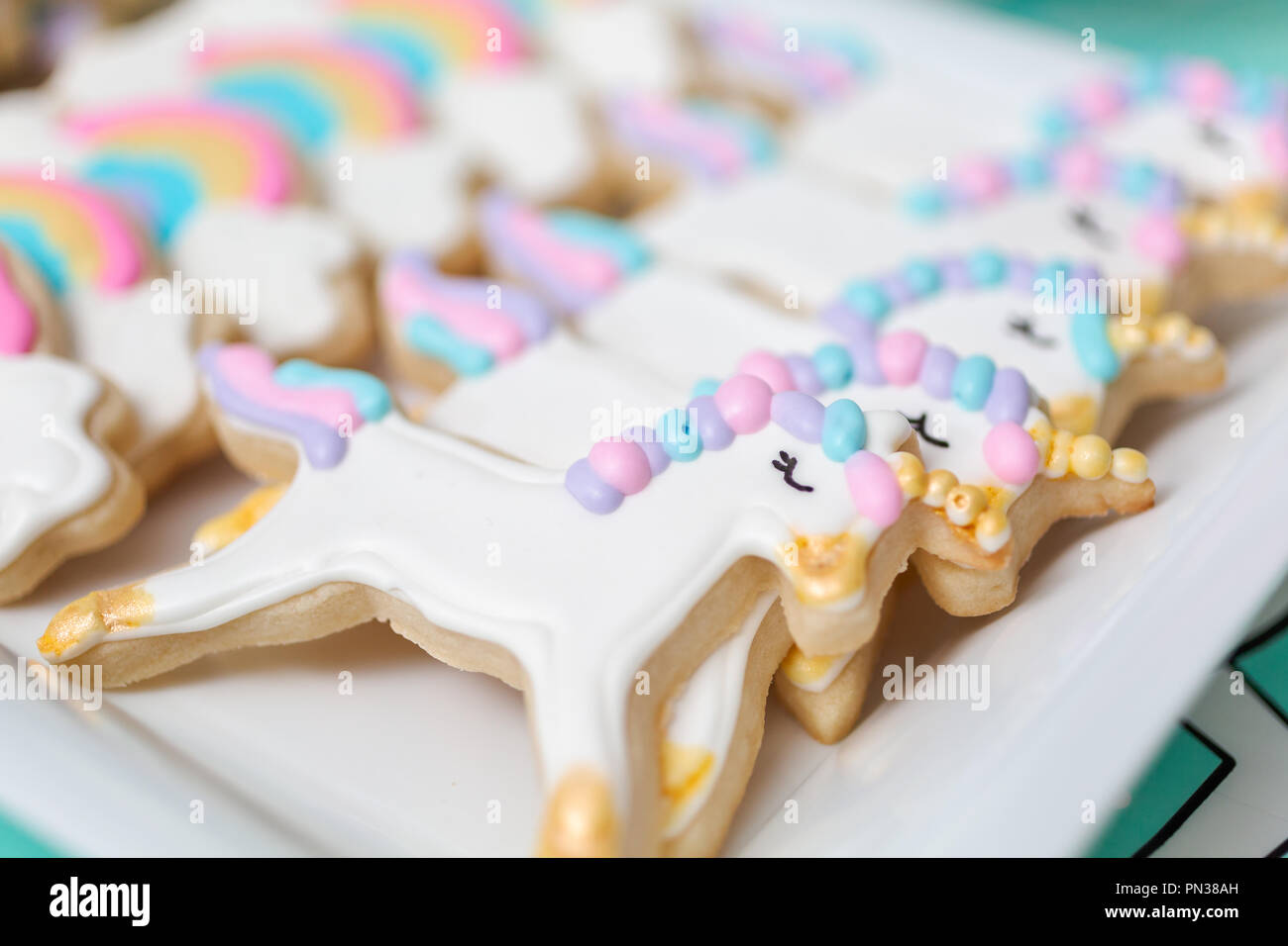 Unicorn sugar cookies on serving tray at little girl birthday party ...