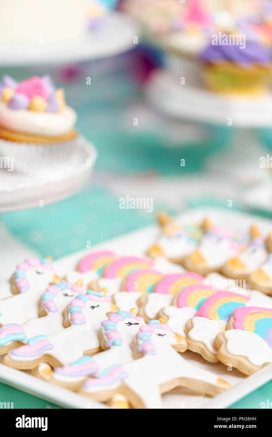 Unicorn sugar cookies on serving tray at little girl birthday party ...