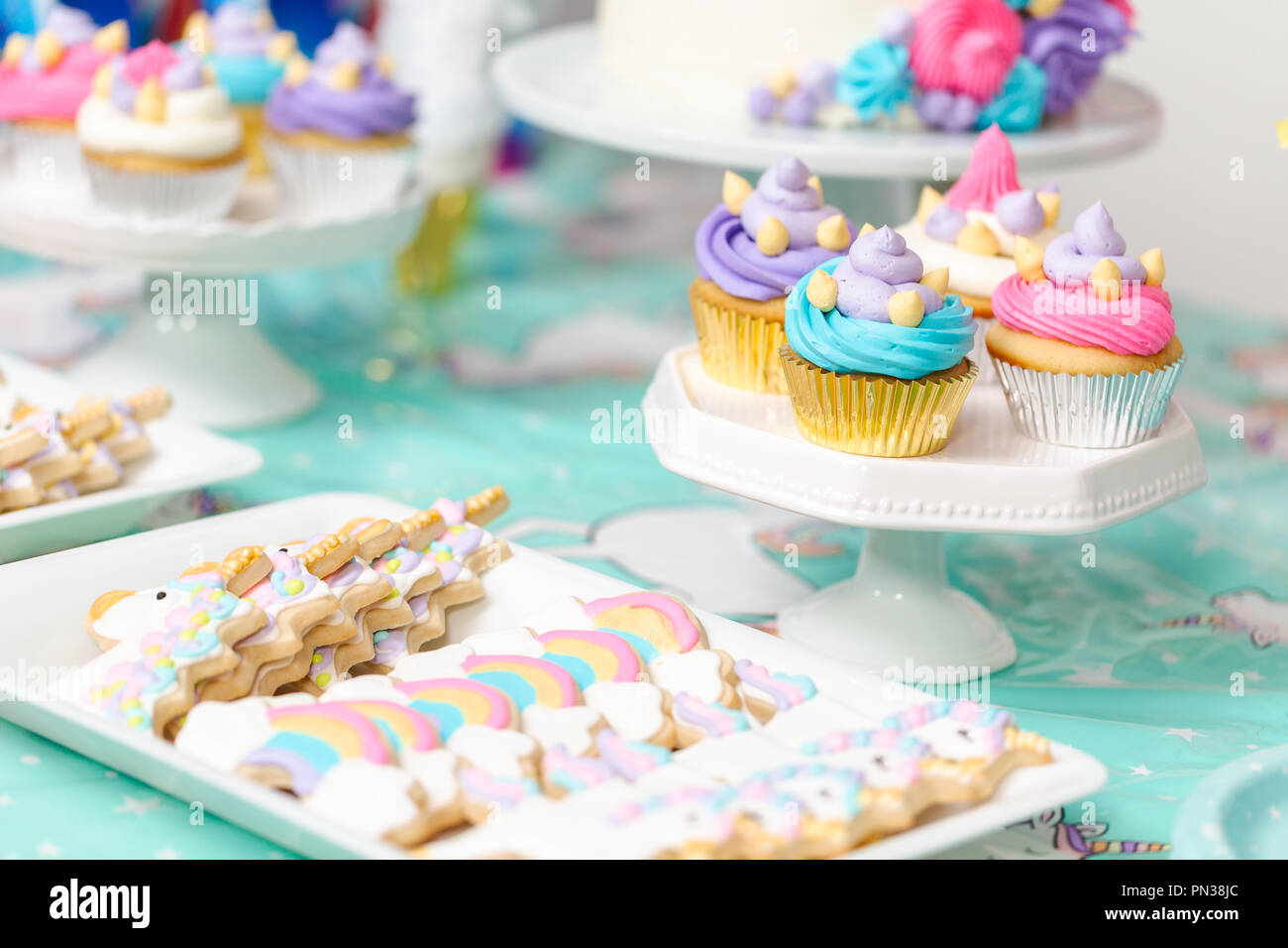 Unicorn sugar cookies on serving tray at little girl birthday party ...