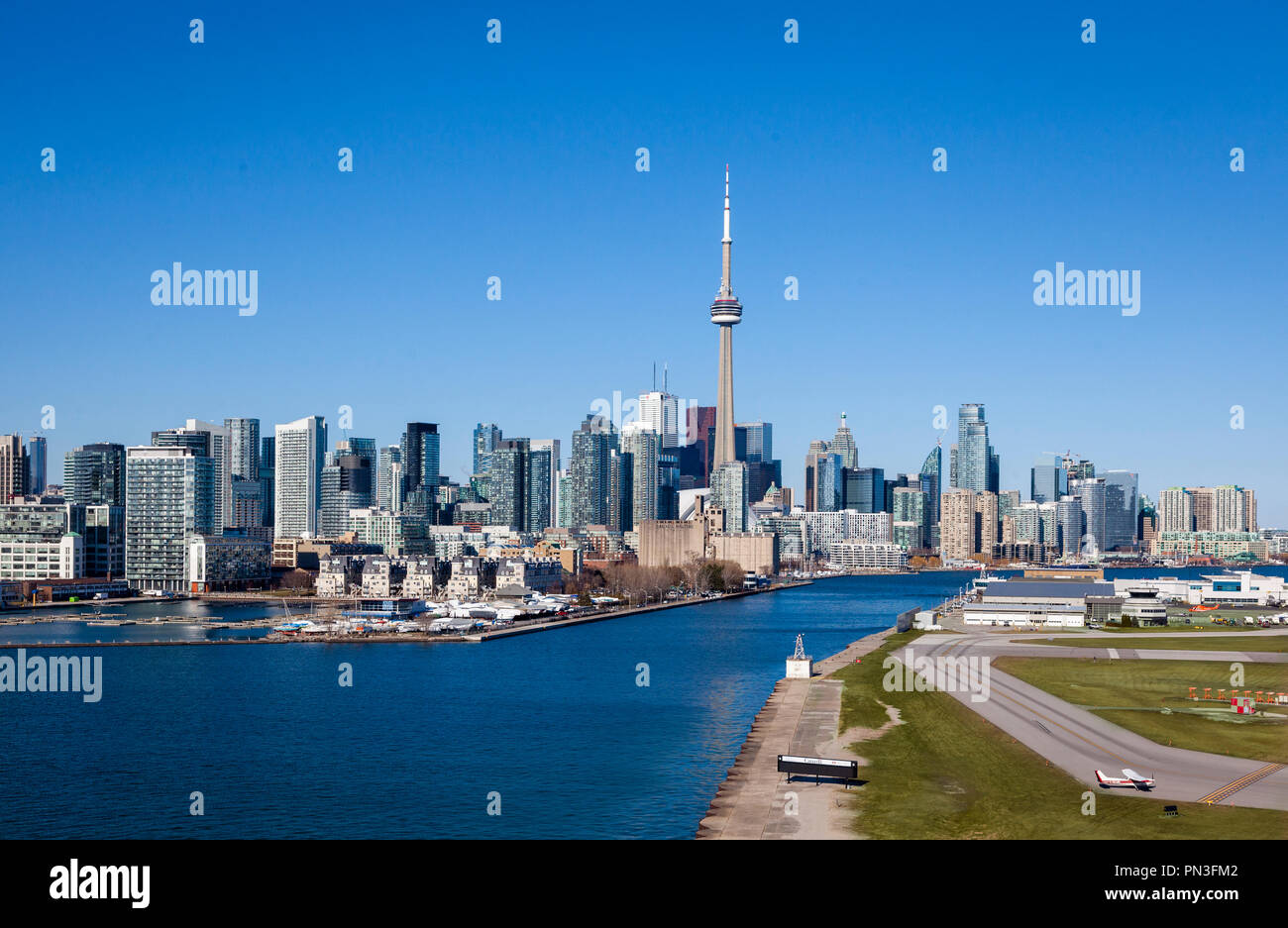 A low level aerial view of the Toronto skyline from final approach to ...