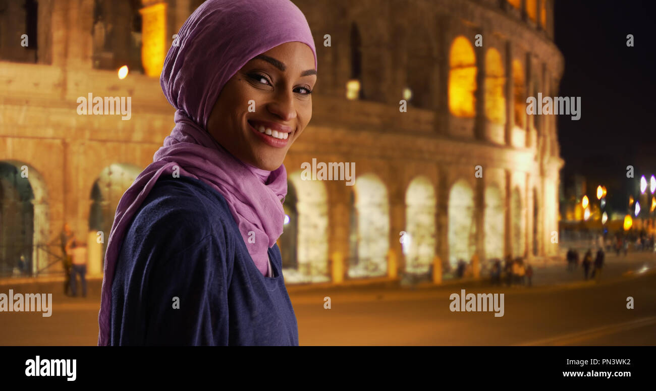Portrait of beautiful young Muslim woman in Rome Italy happy and ...