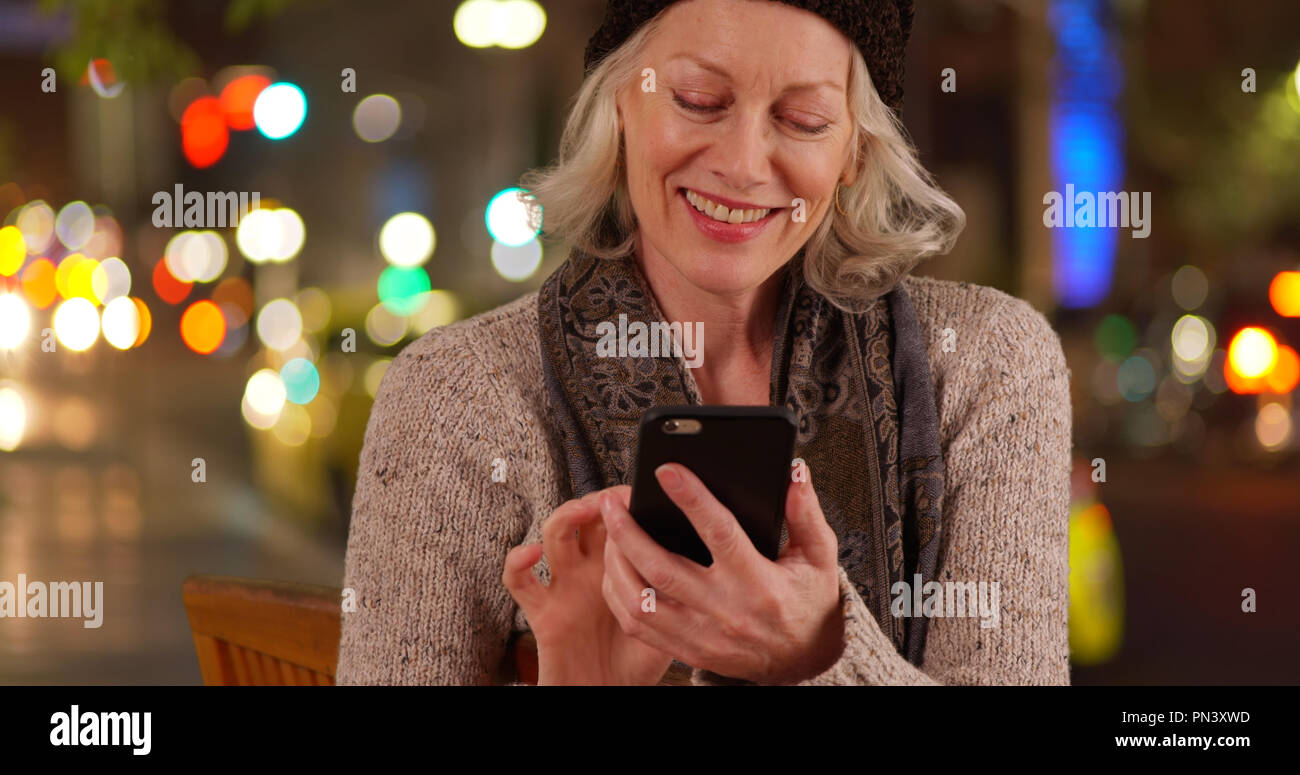 Elderly old lady texting message hi-res stock photography and images ...