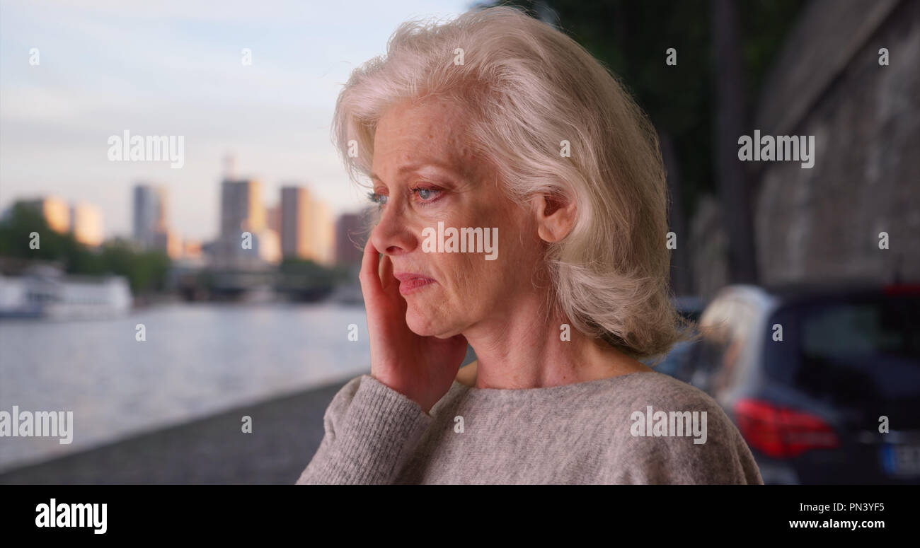 Sad stressed woman on vacation in Paris looking at river Seine Stock ...