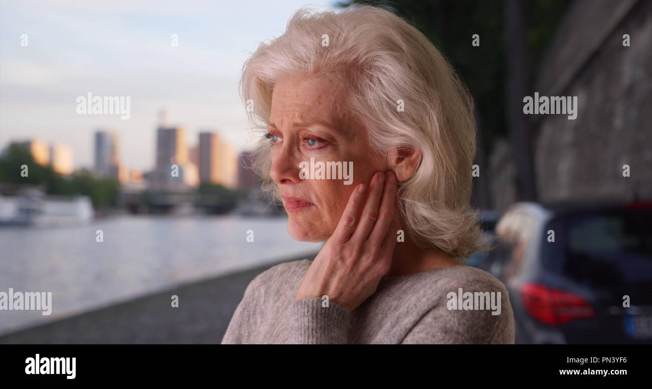 Sad stressed woman on vacation in Paris looking at river Seine Stock ...