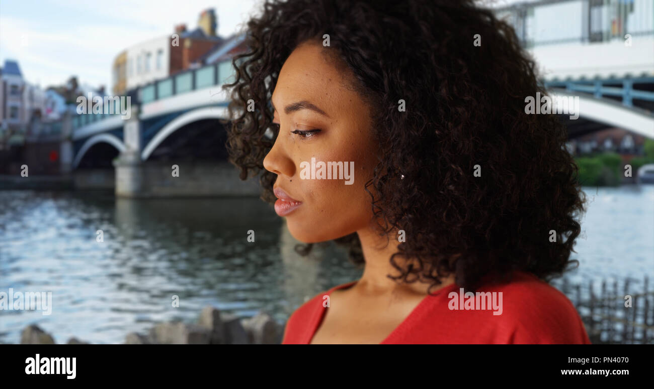 Peaceful looking black female looking off-screen outside in Windsor ...