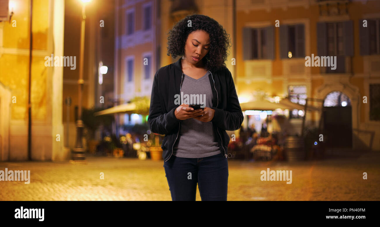 Walking and texting at night hi-res stock photography and images - Alamy