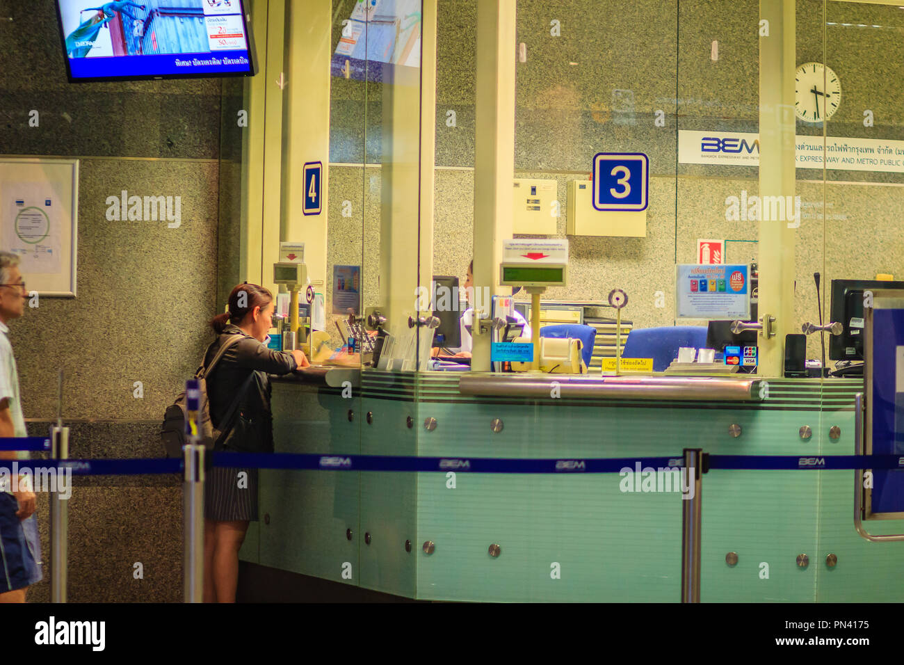 Bangkok, Thailand - April 23, 2017: Unidentified passenger is buying ...