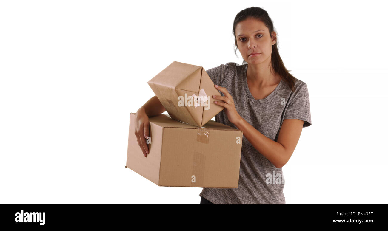 Beautiful Caucasian woman carrying shipping boxes on white background ...