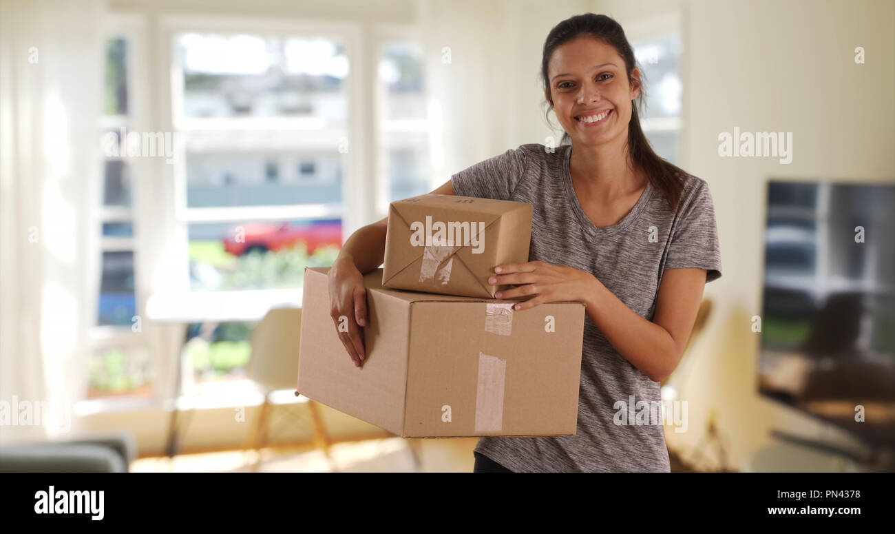 Woman carrying box inside new hi-res stock photography and images - Alamy