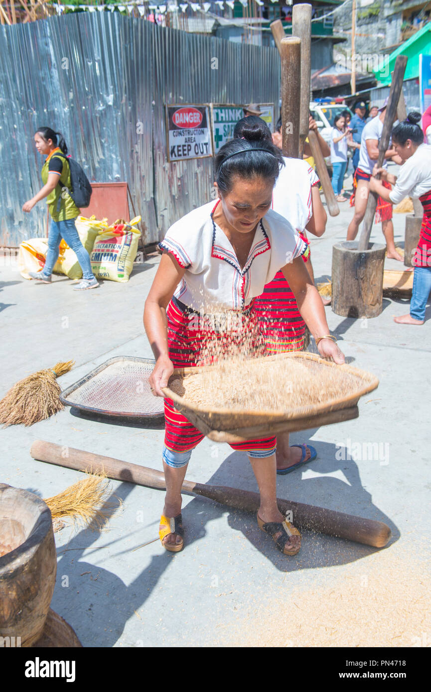 Woman from Ifugao Minority in a rice pounding competion during Imbayah ...