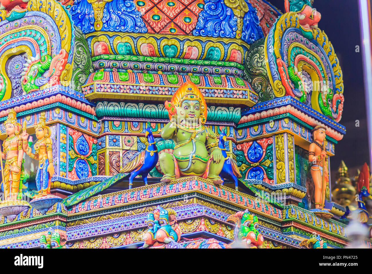 Colorful night view of indian gods sculpture at Sri Maha Mariamman ...