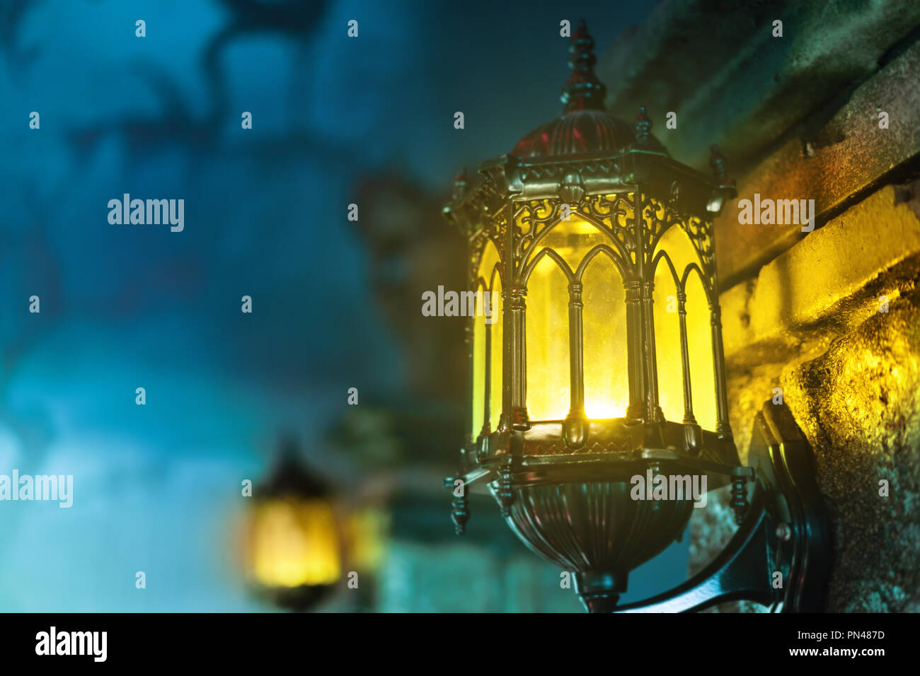 Halloween background with street lamp glowing on spooky night concept ...