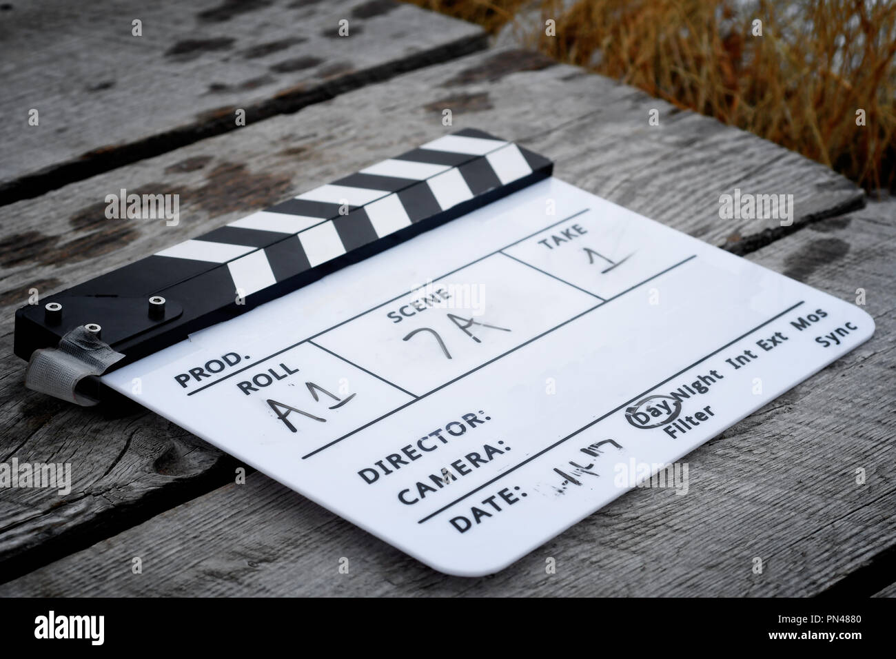 Directors clapboard on a wooden walkway on a movie set Stock Photo - Alamy