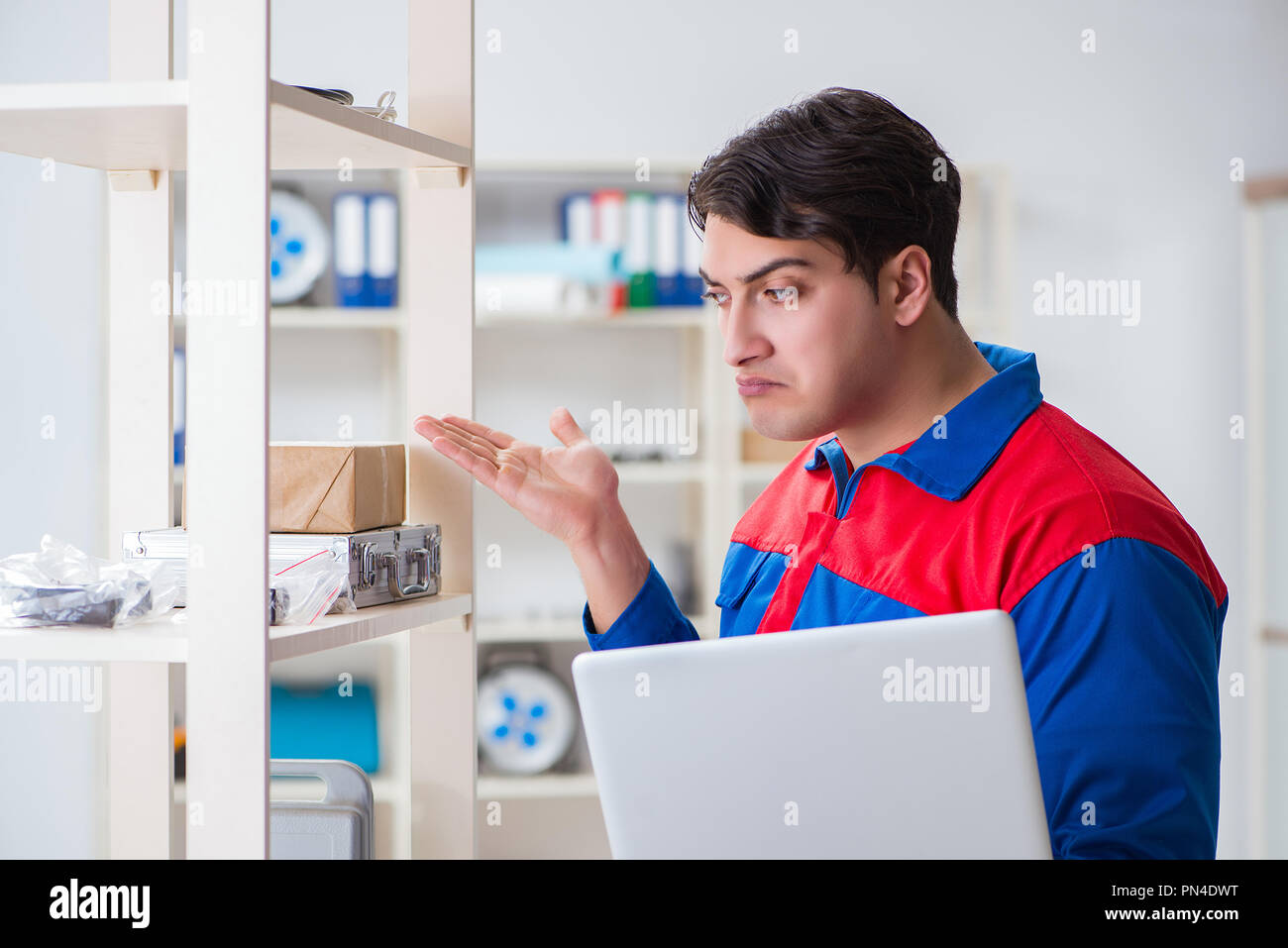 Man working in the postal warehouse Stock Photo - Alamy