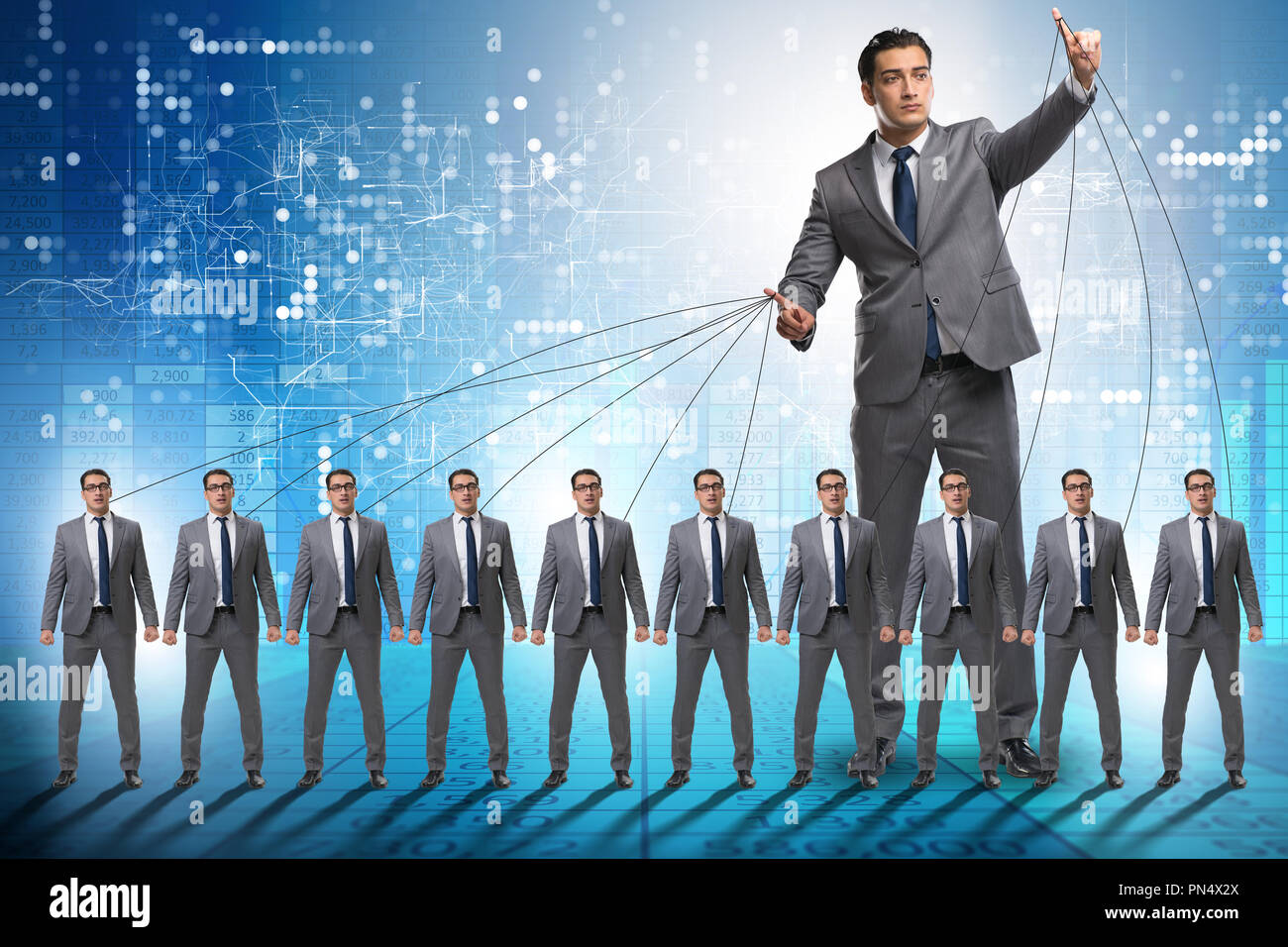 Boss employee manipulating his staff in business concept Stock Photo ...