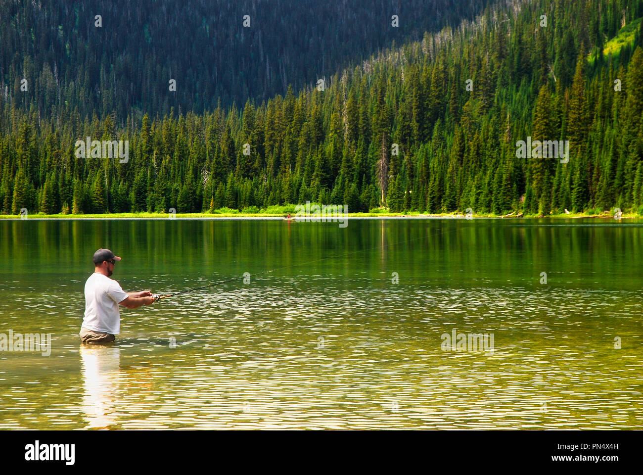 Man fishing on mountain hi-res stock photography and images - Alamy