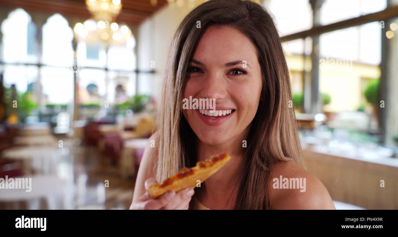 Lady eating pizza hi-res stock photography and images - Alamy