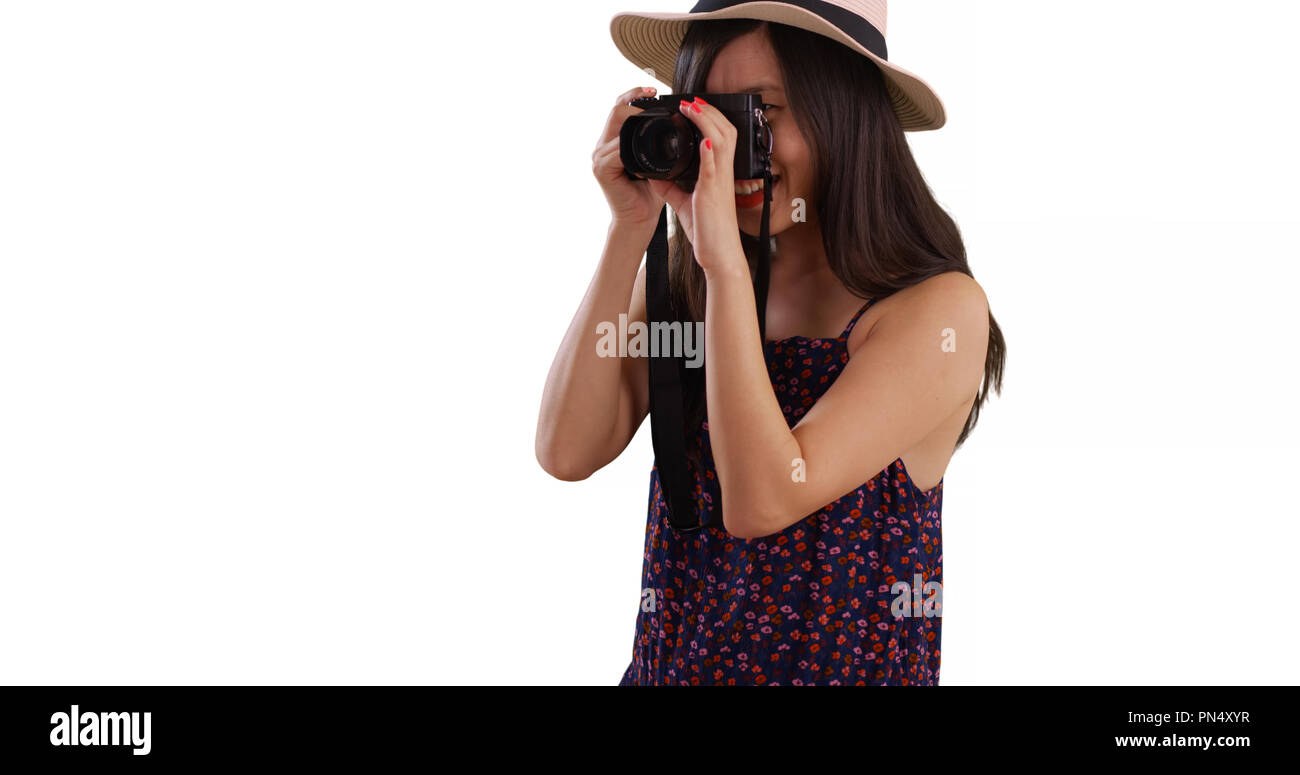 Closeup of Asian millennial photographer taking pictures for copy space ...