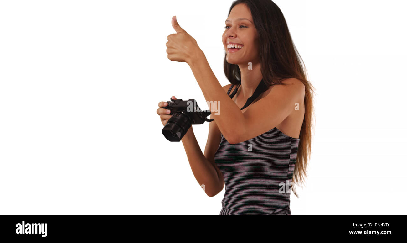 Travel photographer focusing lens then taking snapshot on white ...