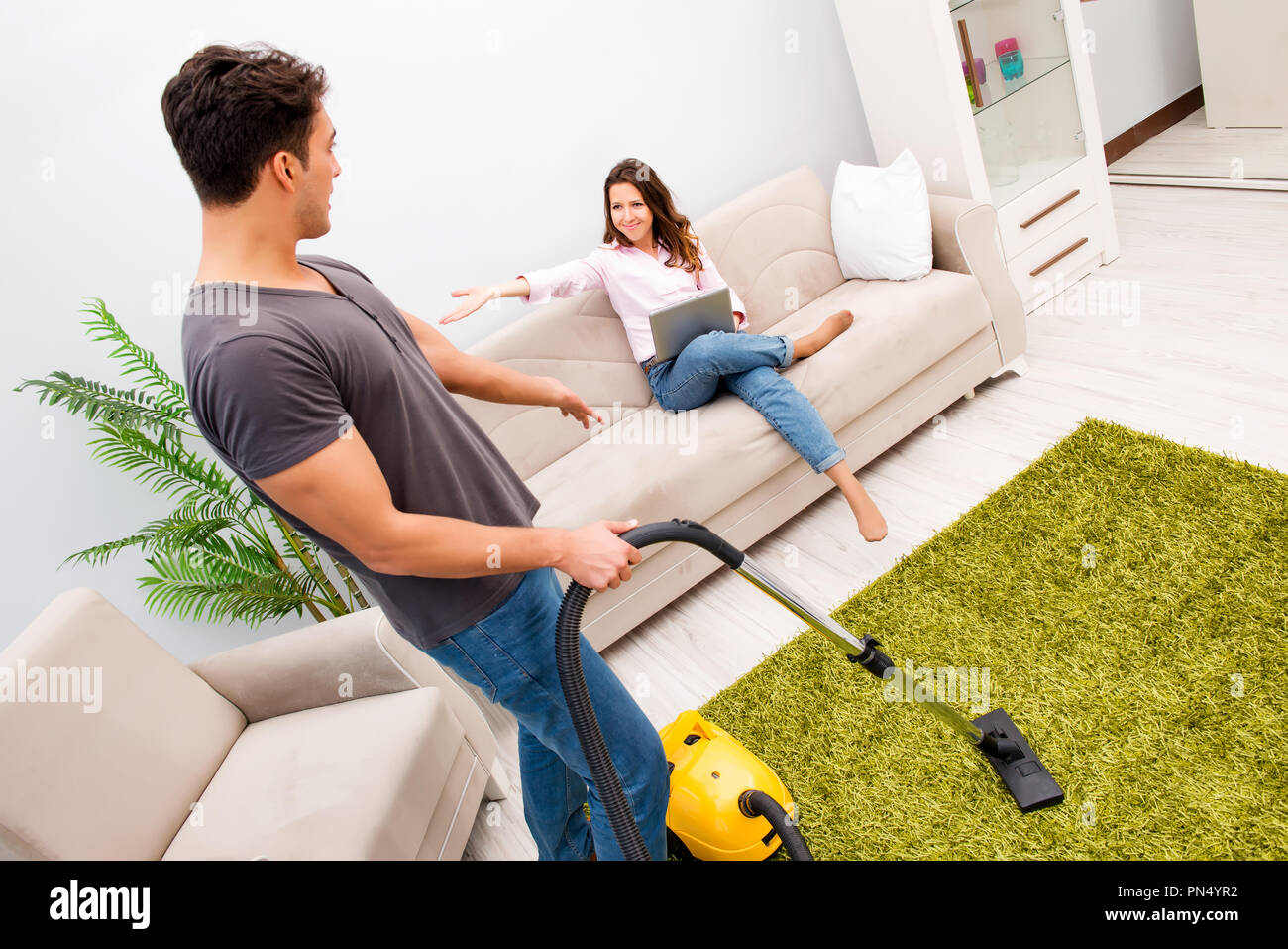 Cleaning the house with vacuum cleaner Stock Photo - Alamy