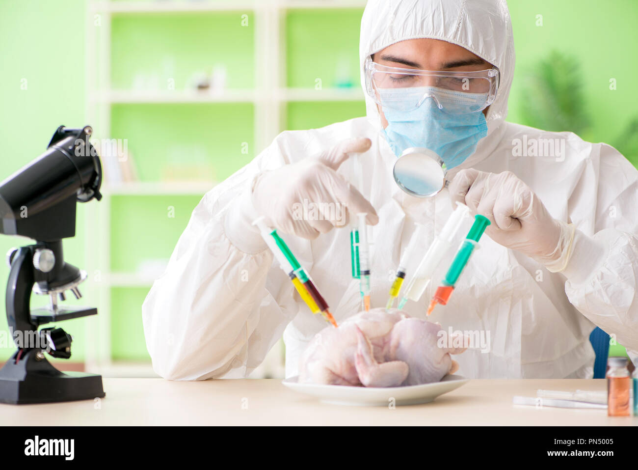 Lab assistant testing GMO chicken Stock Photo - Alamy