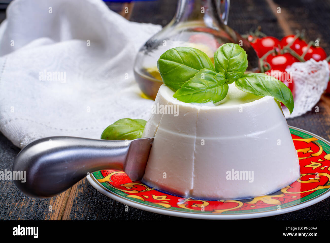 Italian soft cheese, young white ricotta cheese served with fresh basil ...