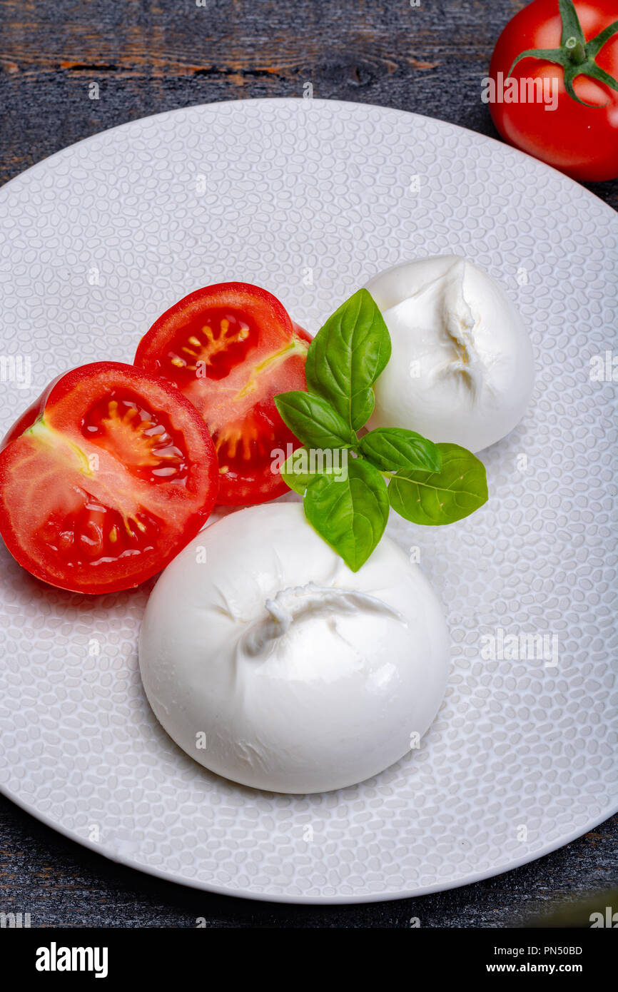 Fresh soft white burrata, ball buttery cheese, made from a mix of ...