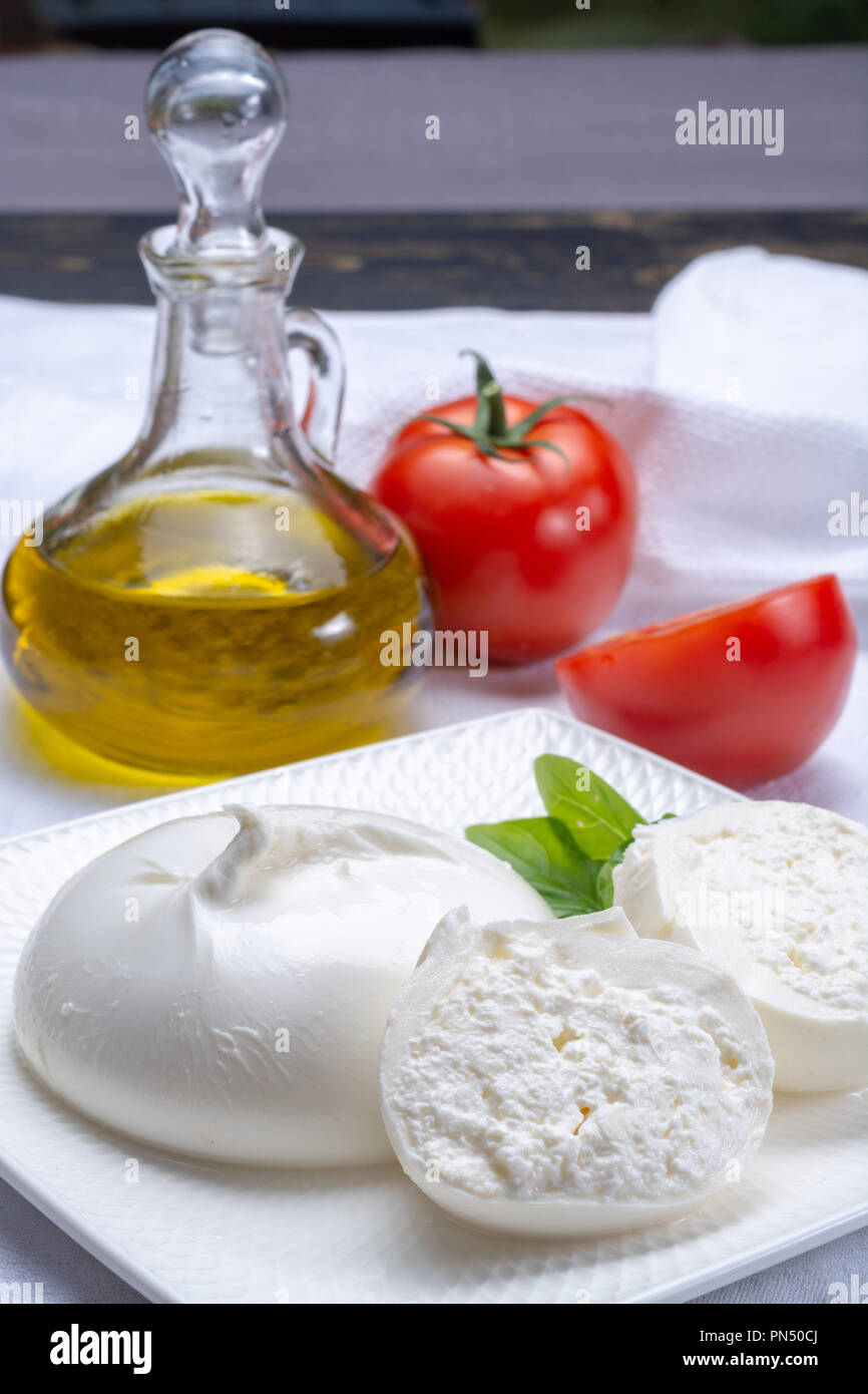 Fresh soft white burrata, ball buttery cheese, made from a mix of ...