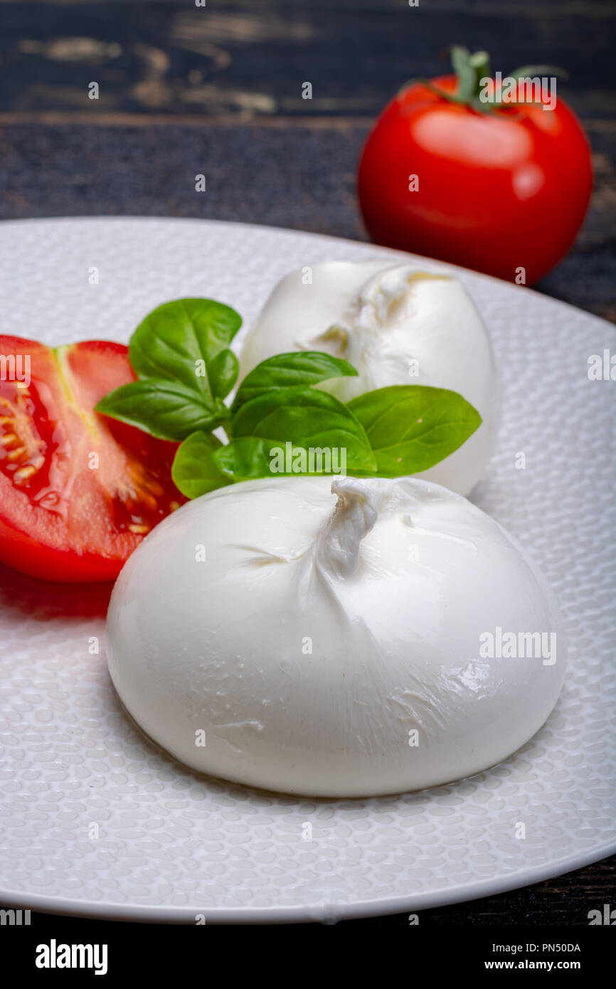 Fresh soft white burrata, ball buttery cheese, made from a mix of ...