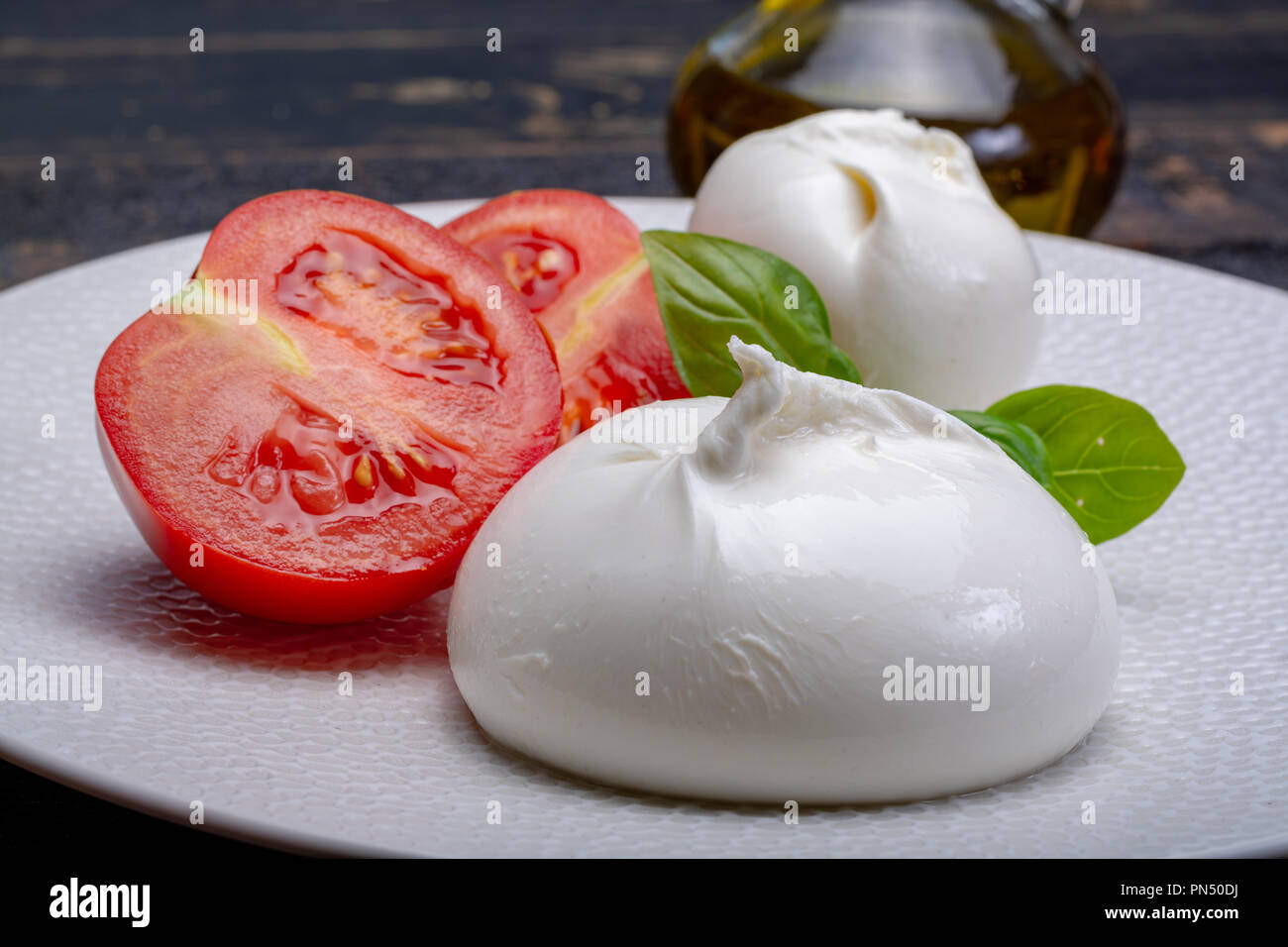 Fresh soft white burrata, ball buttery cheese, made from a mix of ...