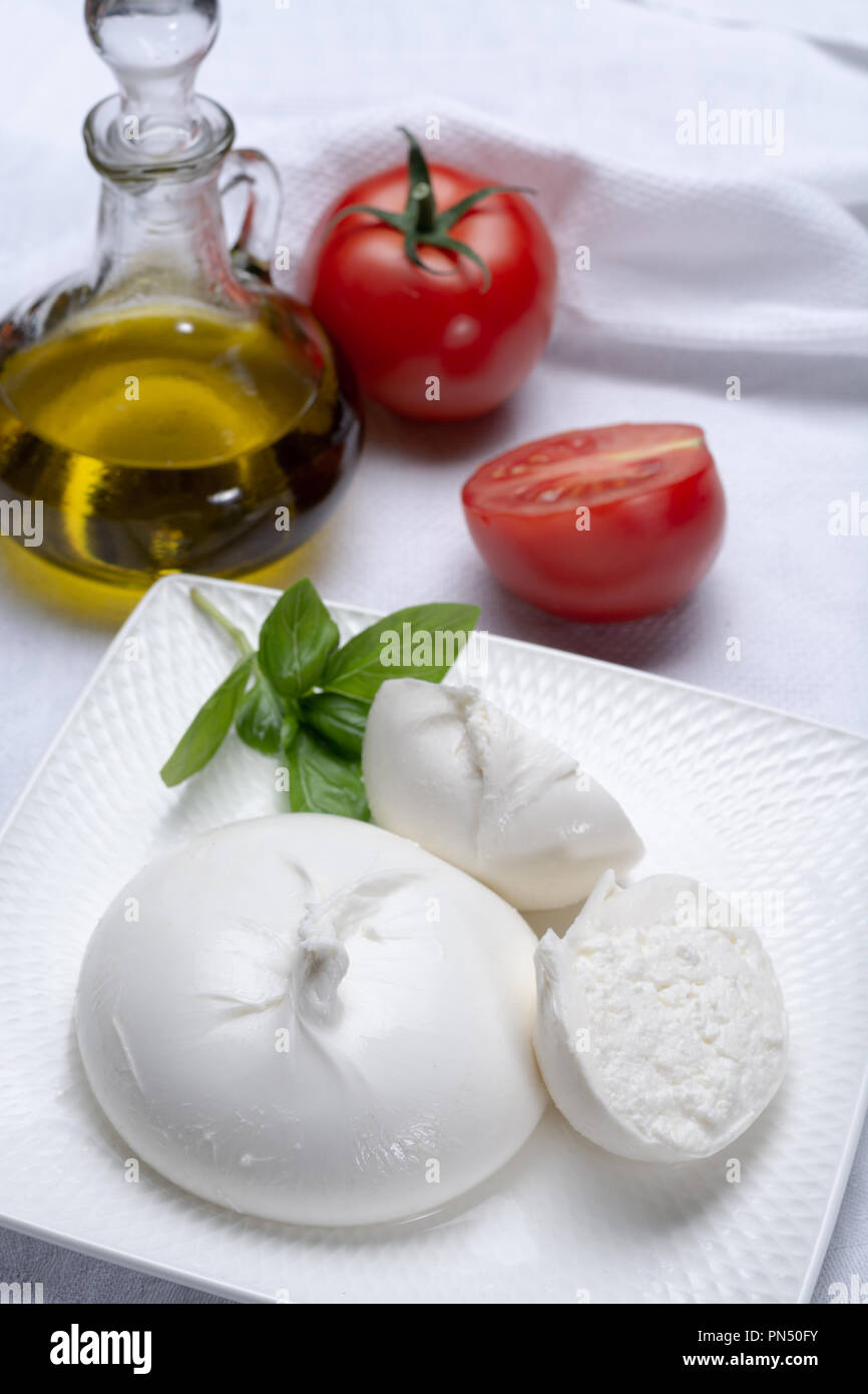 Fresh soft white burrata, ball buttery cheese, made from a mix of ...