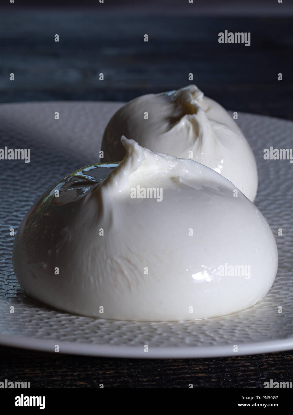 Fresh soft white burrata, ball buttery cheese, made from a mix of ...
