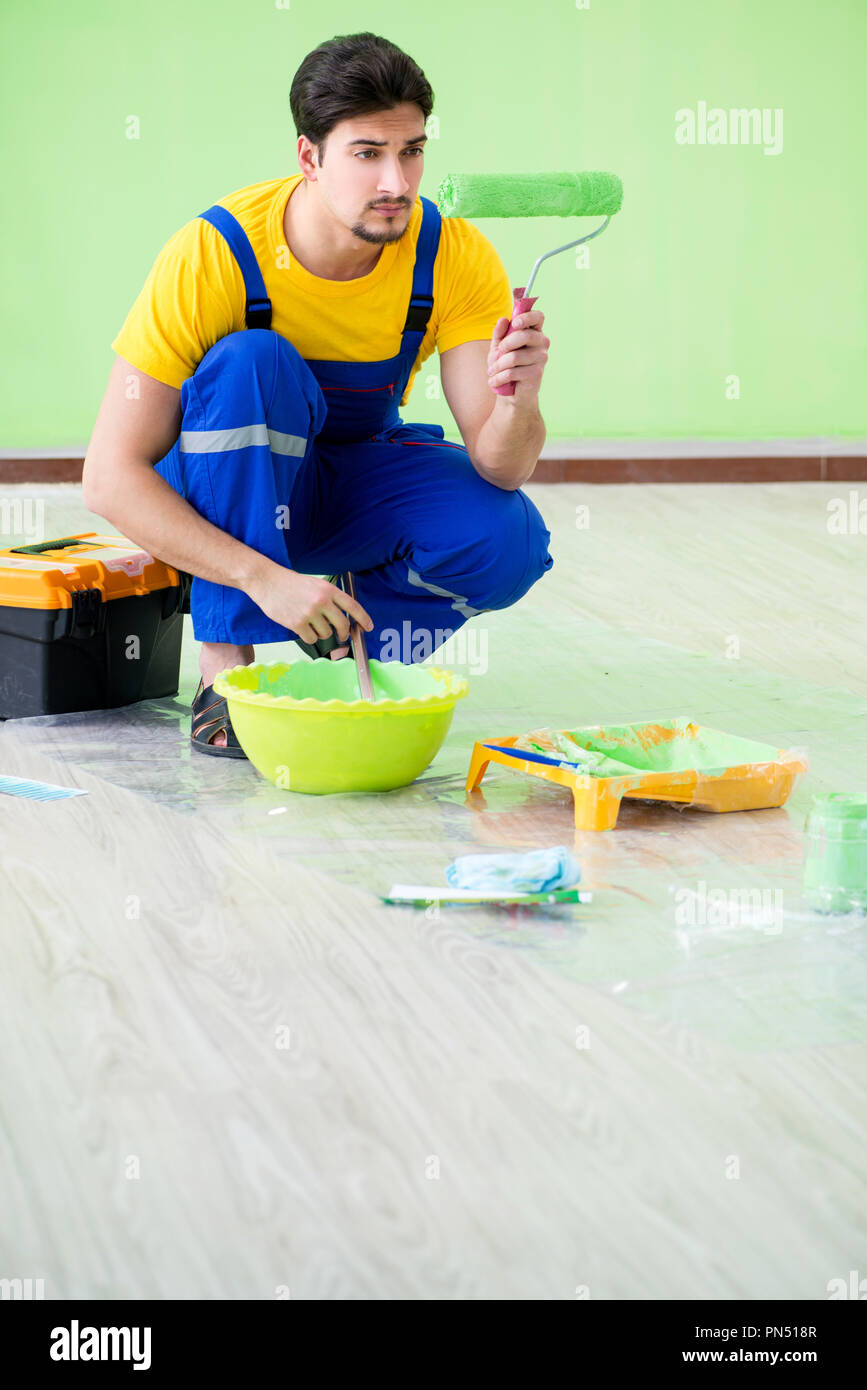 Young man doing home renovation Stock Photo - Alamy