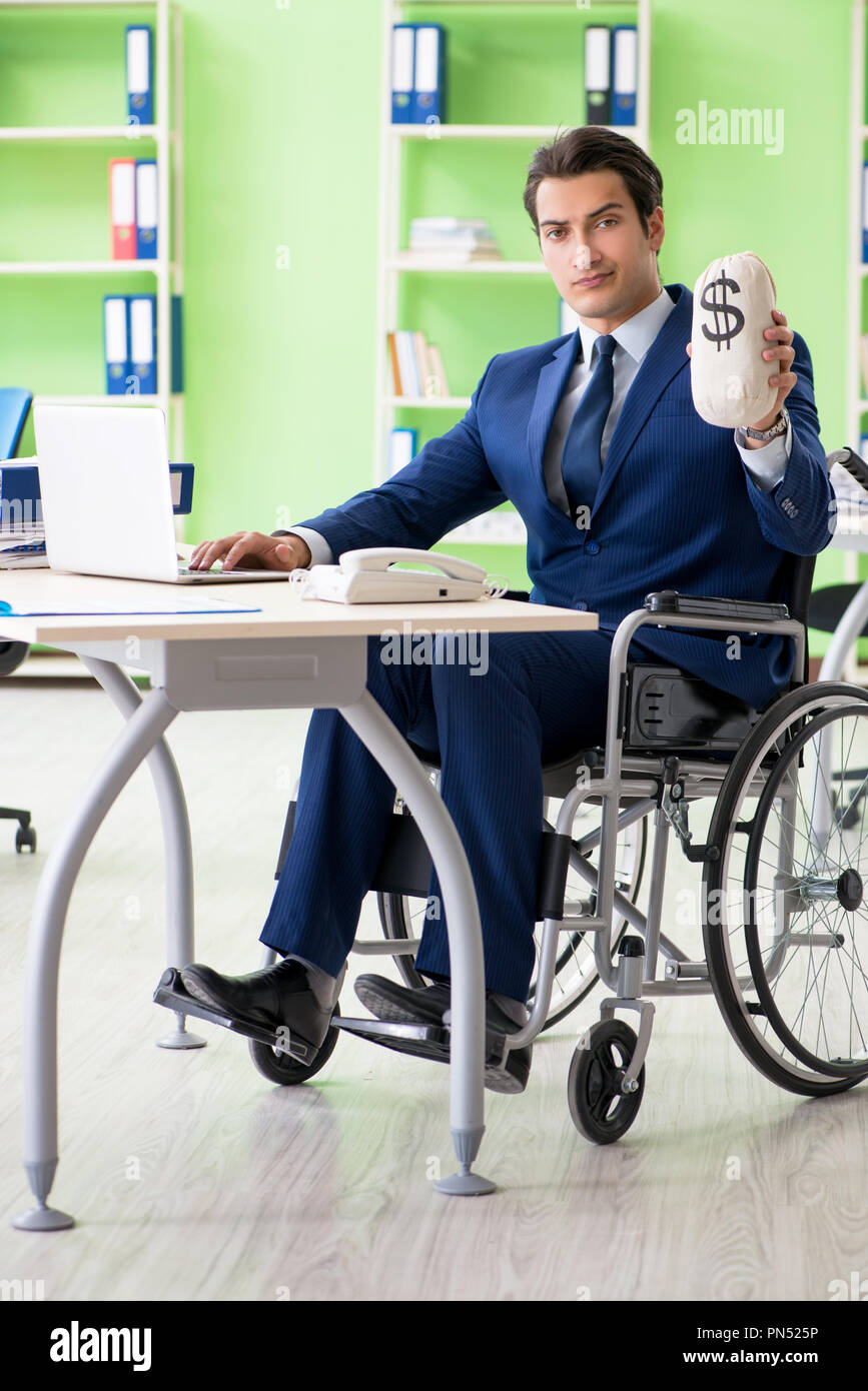 Disabled businessman working in the office Stock Photo - Alamy
