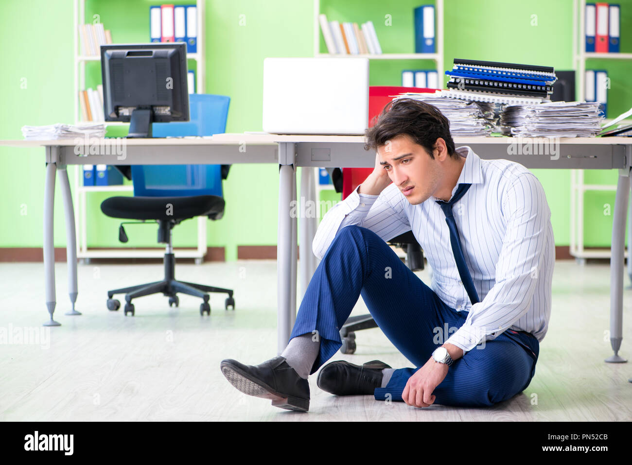 Frustrated businessman stressed from excessive work Stock Photo - Alamy
