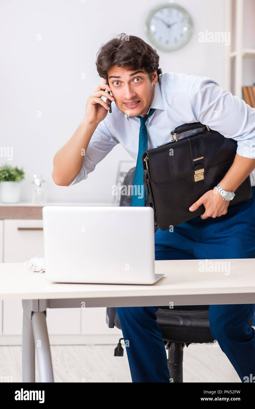Overloaded busy employee with too much work and paperwork Stock Photo ...