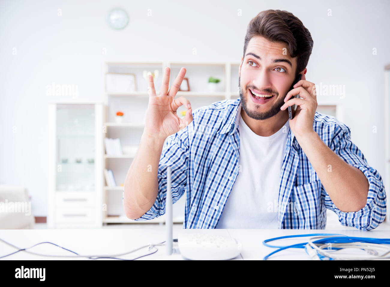 Man enjoying fast internet connection Stock Photo - Alamy