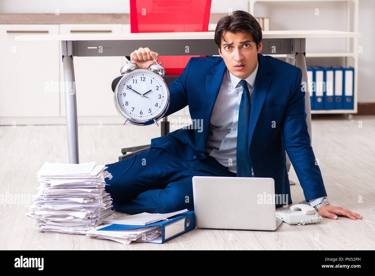 Tired exhausted businessman working overtime in office Stock Photo - Alamy