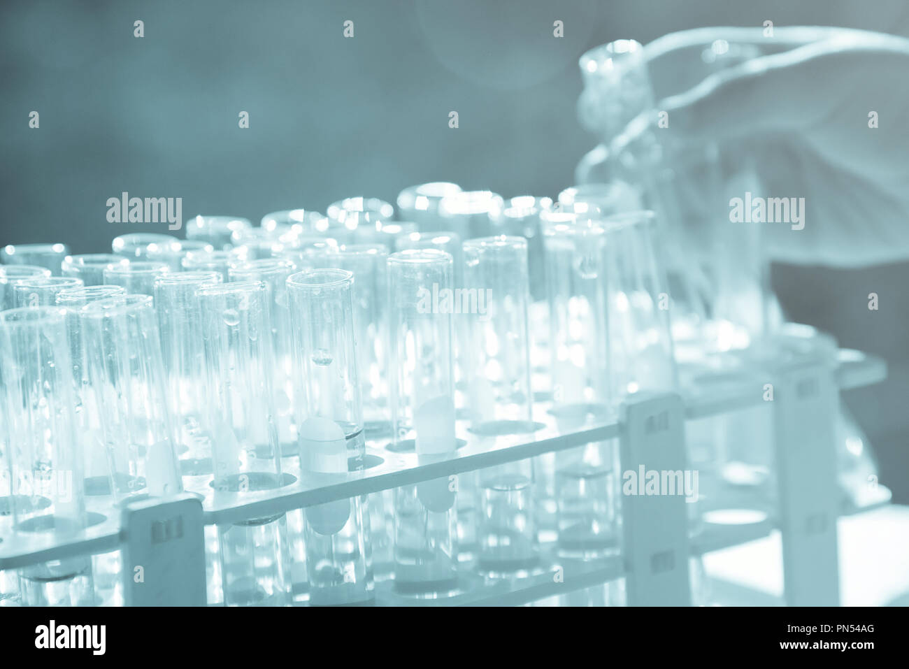 Scientist adding solution test tube hi-res stock photography and images ...