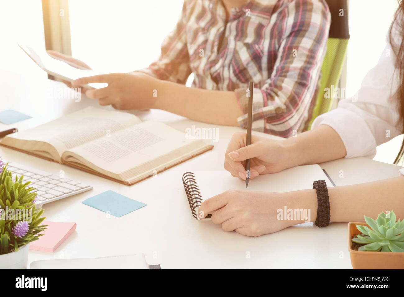 Cropped shot of publishing house workplace a people working with a ...