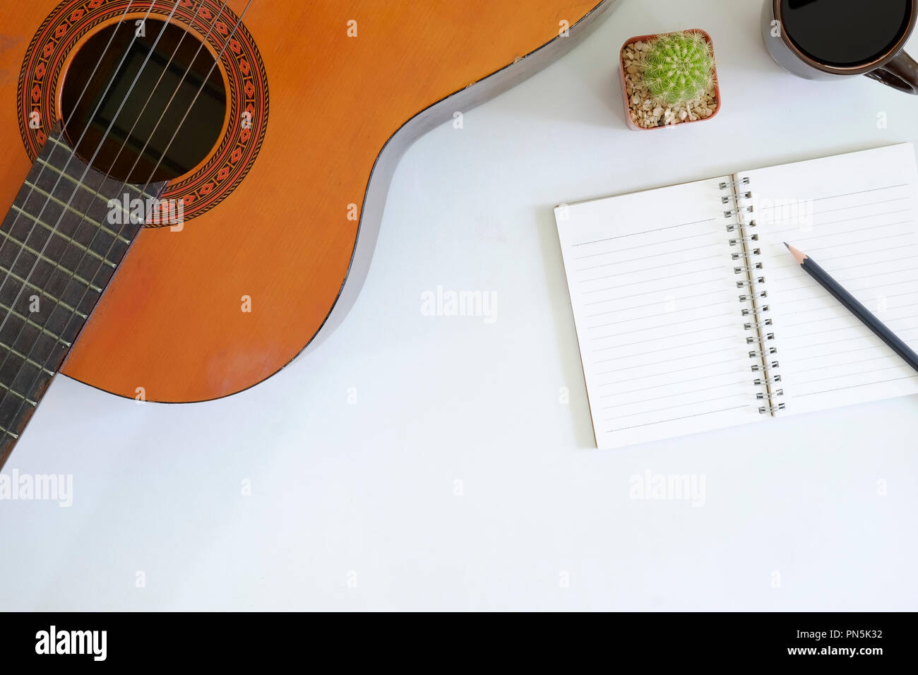 song writer table a workspace with musician acoustic guitar and coffee ...