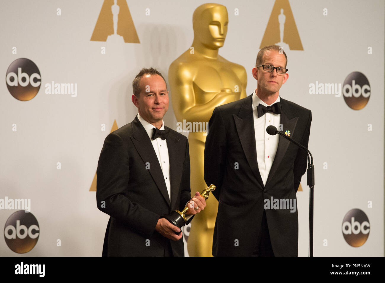 Jonas Rivera and Pete Docter pose backstage with the Oscar® for Best ...