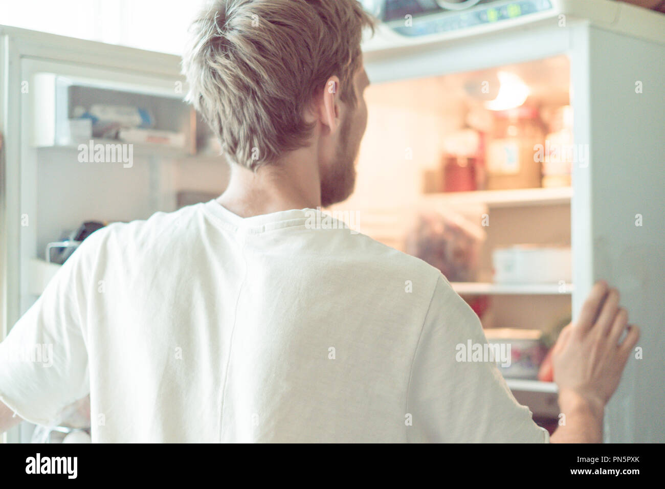 Man fridge isolated hi-res stock photography and images - Alamy