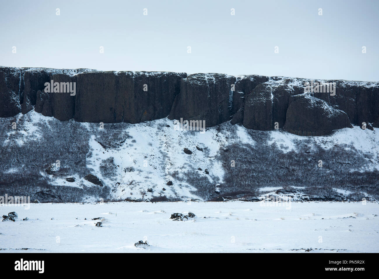 Typical dramatic Icelandic landscape of snow covered mountains of ...