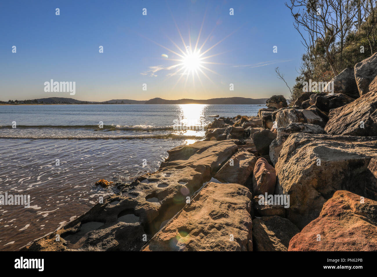 Sun rising over ocean hi-res stock photography and images - Alamy