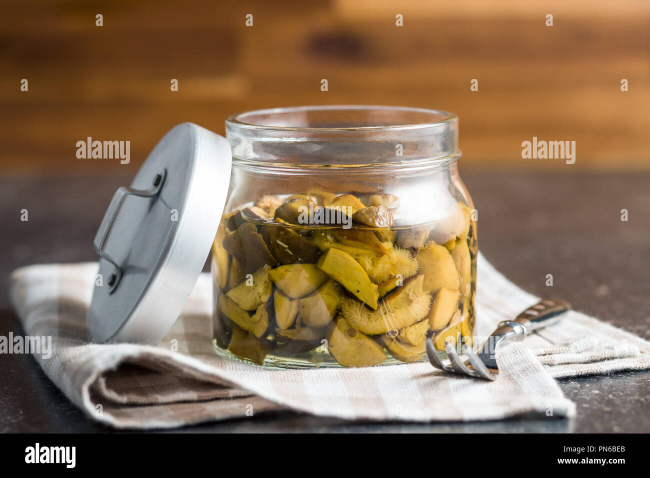 Pickled mushrooms. Marinated boletus in jar Stock Photo - Alamy