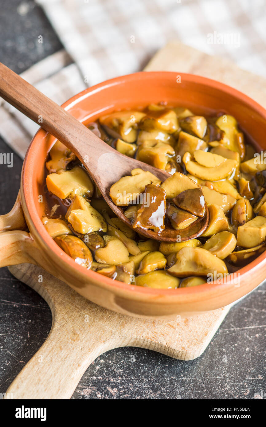 Pickled mushrooms. Marinated boletus in bowl Stock Photo - Alamy